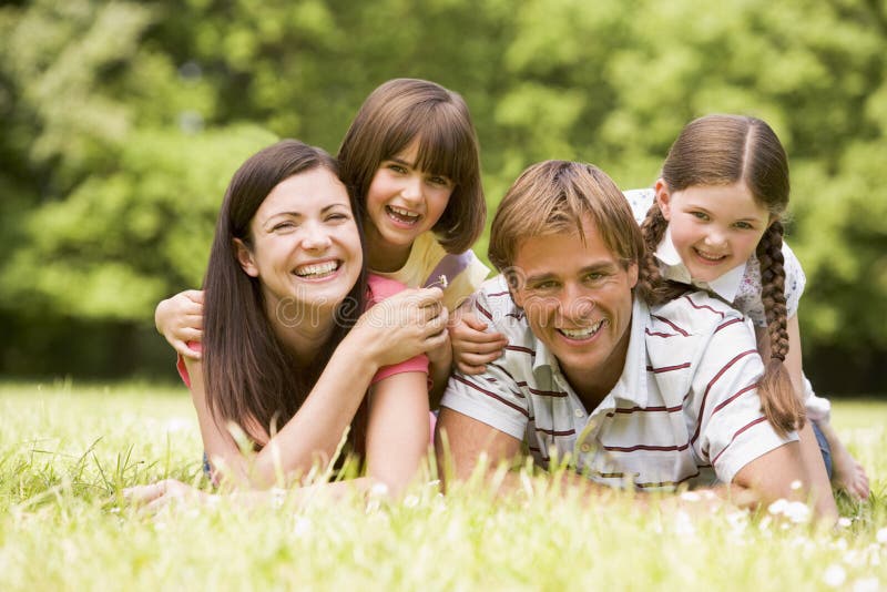 Family Outdoors in Rain with Umbrella Smiling Stock Photo - Image of ...