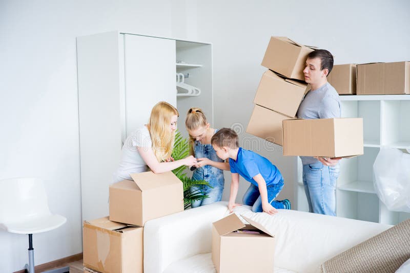 Family Packing Cardboard Boxes Stock Image - Image of indoors, parents ...