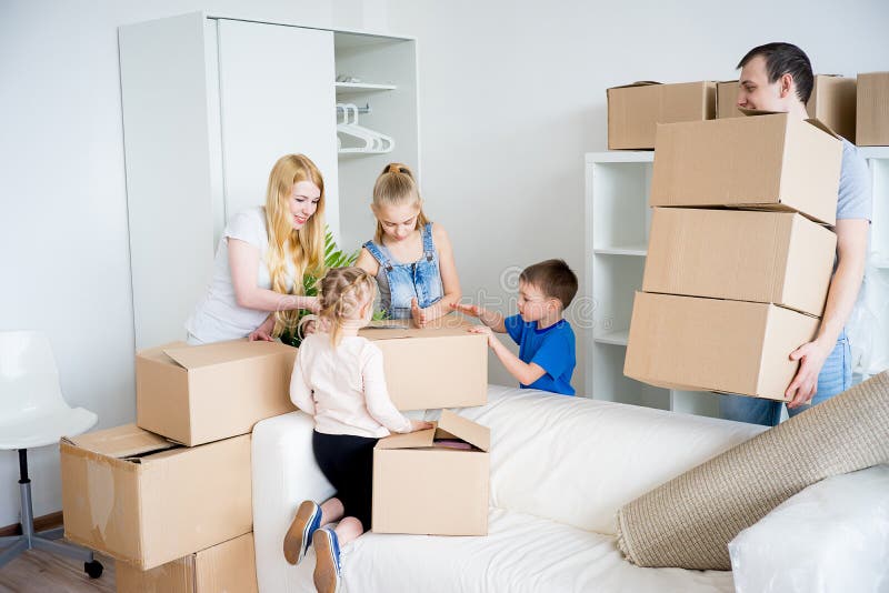 Family Packing Cardboard Boxes Stock Image - Image of childhood, casual ...