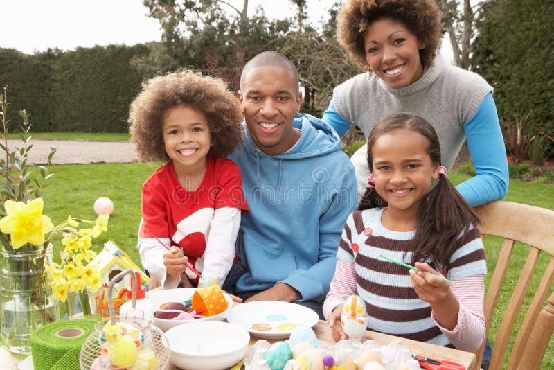 Family Decorating Easter Eggs on Table Outdoors Stock Photo - Image of ...
