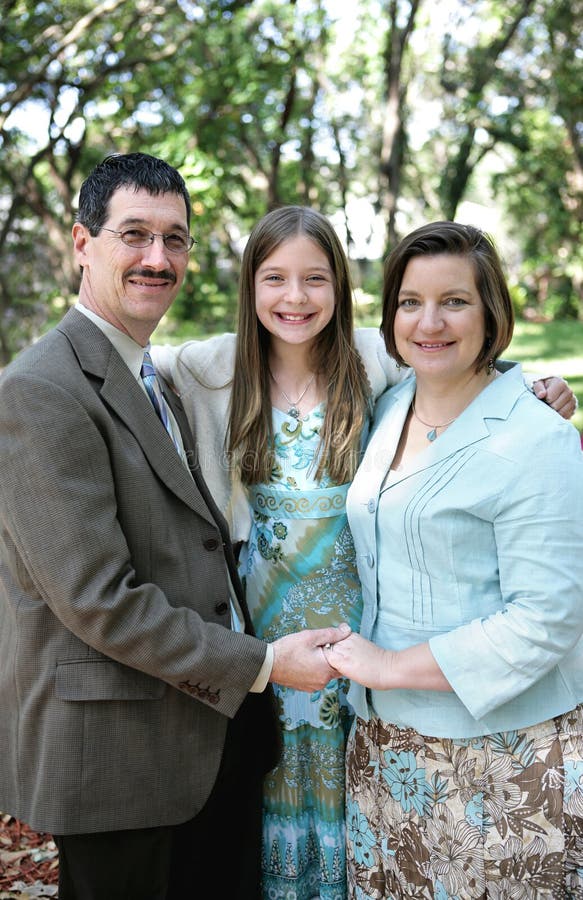 Family in Park Vertical stock image. Image of outdoors - 2235067