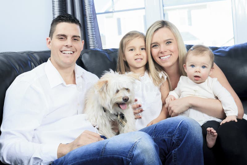 Family with Pets Sit on Sofa at Home Stock Image - Image of female ...