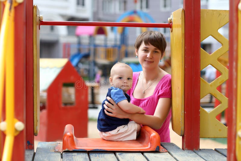 Family at playground stock photo. Image of expressing - 25751444