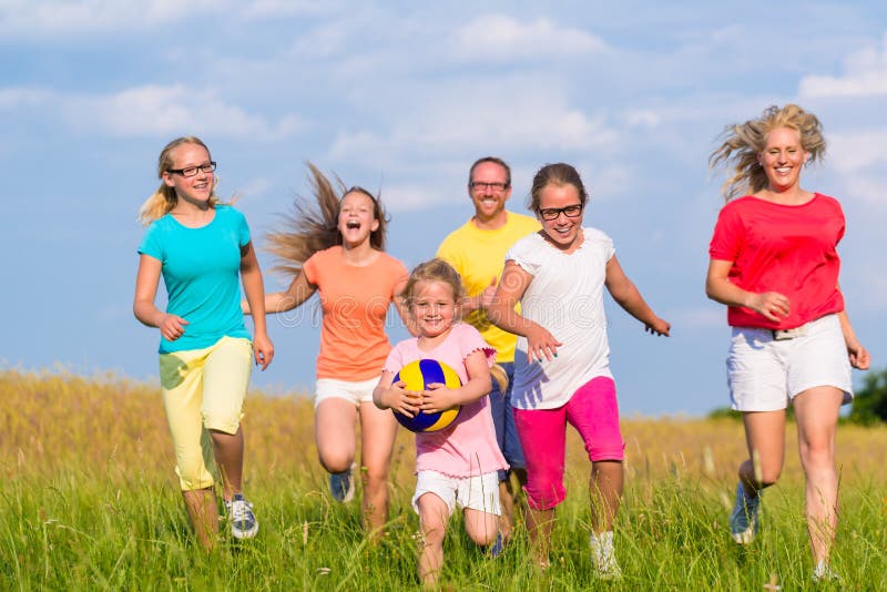 Family Playing Tag on Meadow in Summer Stock Image - Image of lifestyle ...