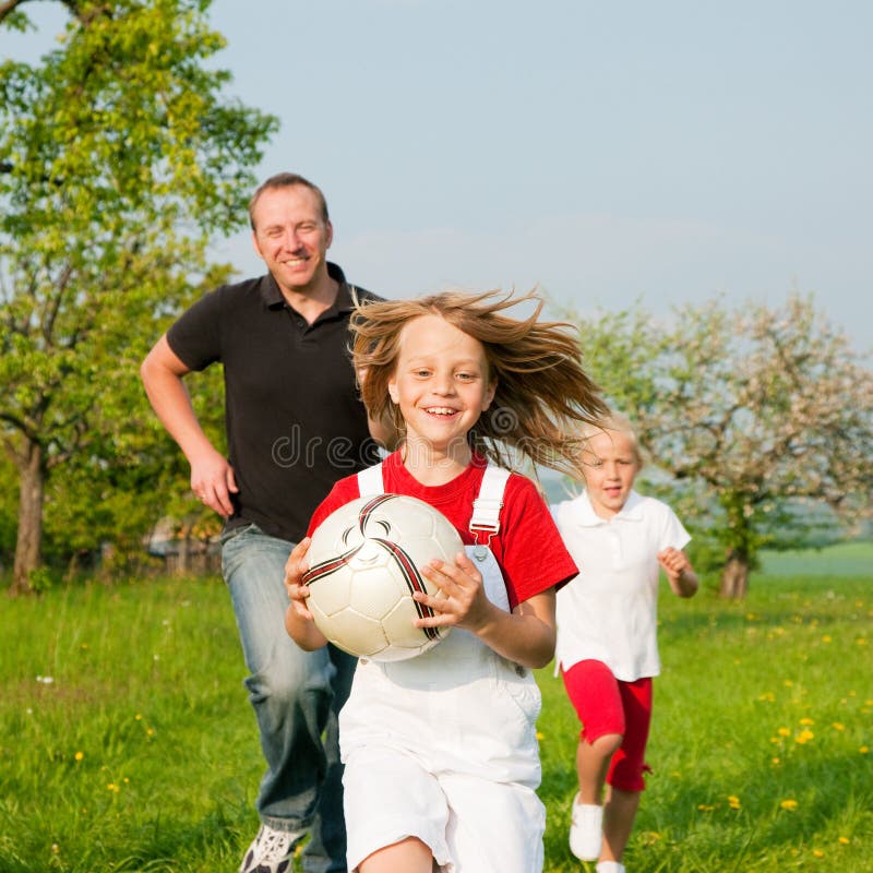 Family Playing Tag on Meadow in Summer Stock Image - Image of lifestyle ...