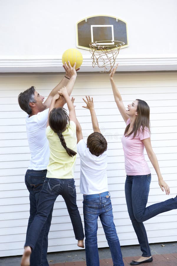 Family Playing Basketball Outside Garage Stock Image - Image of female ...