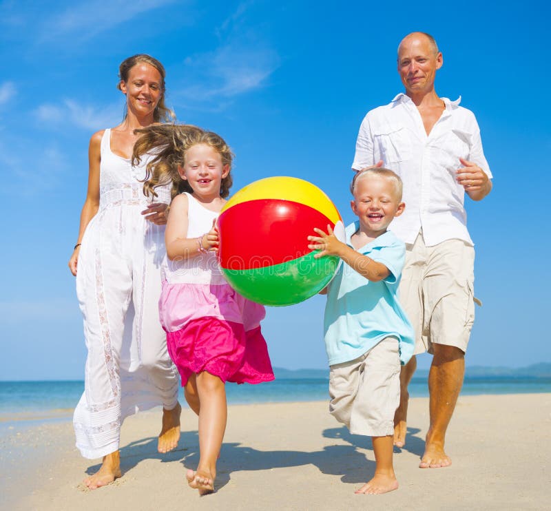 Family Playing on the Beach Stock Photo - Image of blue, beach: 37511196