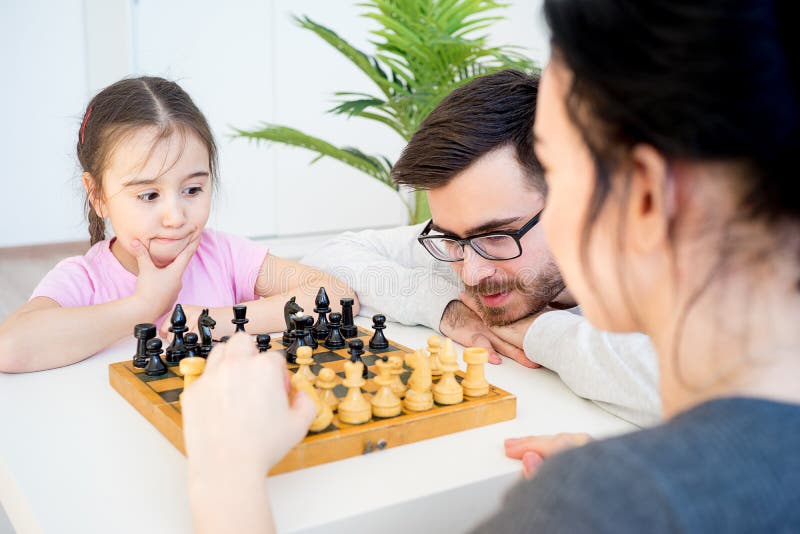 Family playing chess stock image. Image of intelligence - 90874143