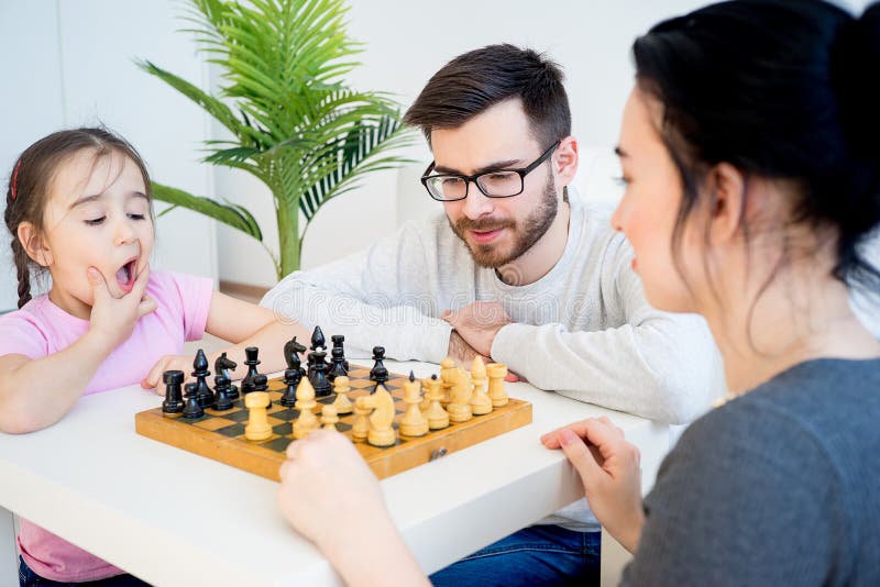 Family playing chess stock image. Image of indoor, happy - 90874187