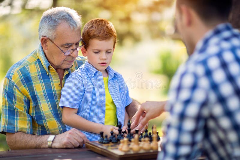 Family playing chess stock photo. Image of senior, grandfather - 70131042