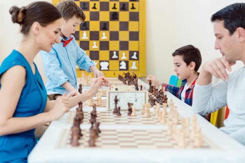 Family Playing Chess in Tournament Room Stock Image - Image of young ...