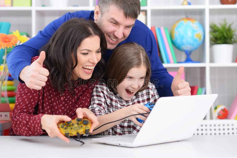 Family Playing a Computer Game Stock Photo - Image of mother, young ...