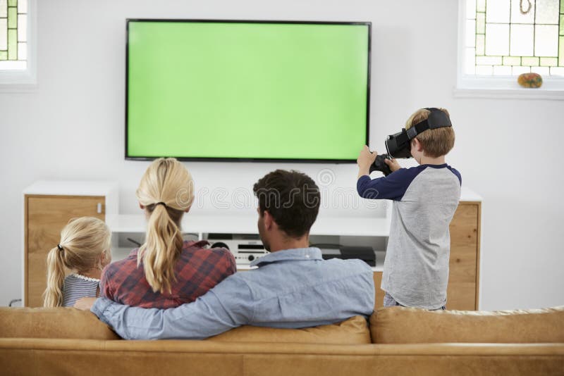 Family Playing Computer Game Using Virtual Reality Headset Stock Image ...