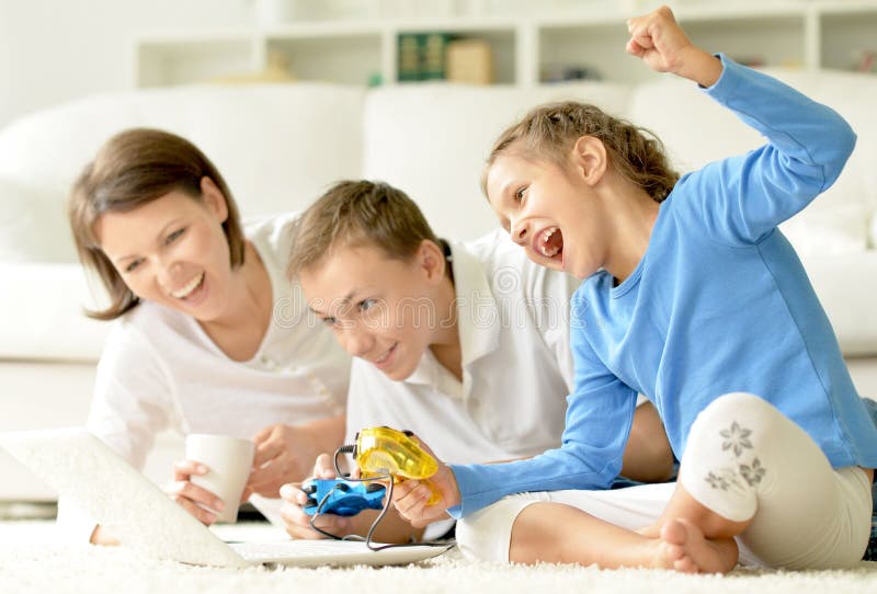 Family Playing Computer Games Stock Image - Image of daughter, color ...