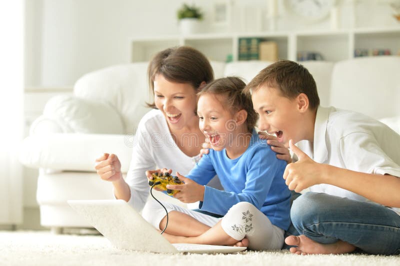 Family Playing Computer Games Stock Photo - Image of daughter, games ...