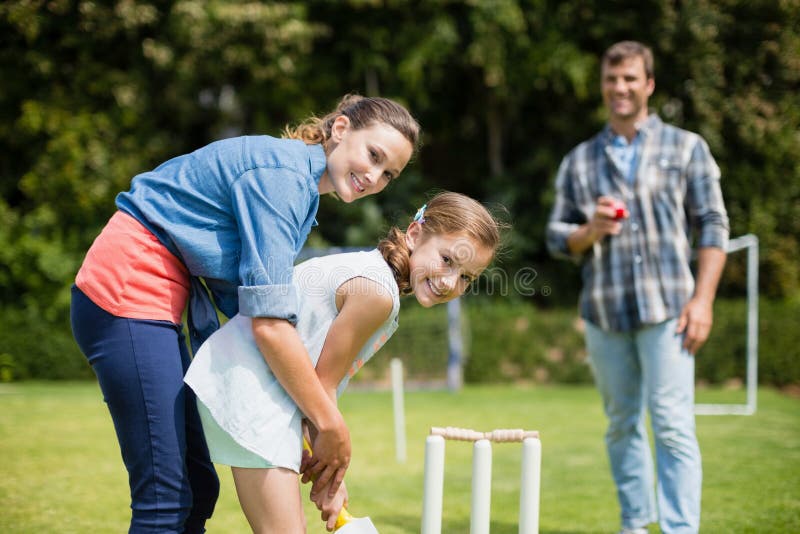 Family Playing Cricket in Park Stock Image - Image of active, girl ...