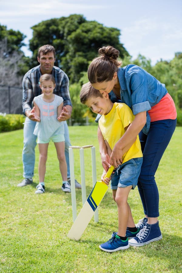 Family Playing Cricket in Park Stock Photo - Image of family, cricket ...