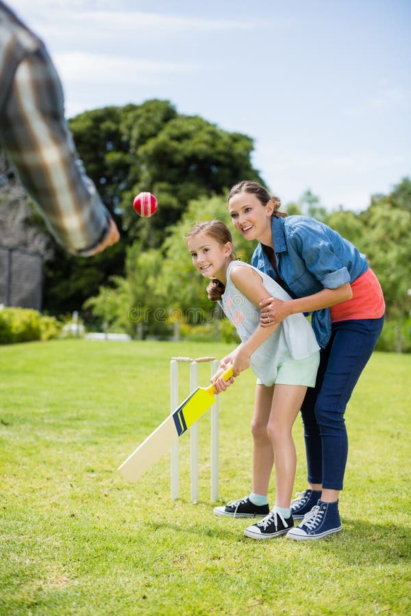Family Playing Cricket in Park Stock Image - Image of children, family ...