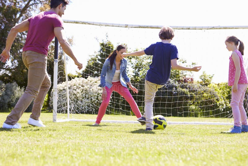 Family Playing Football Together Stock Image - Image of outdoors, goal ...