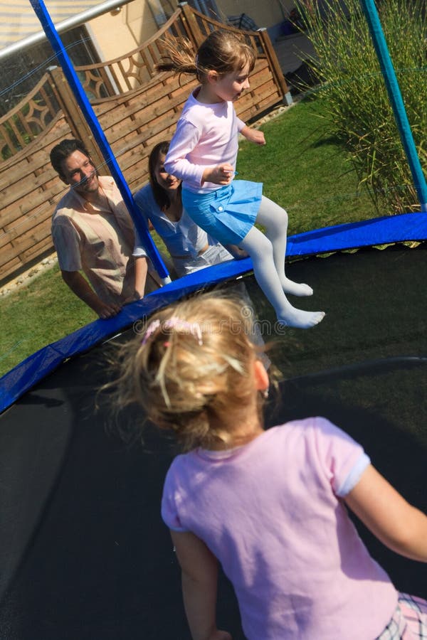 Family Playing in the Garden Stock Photo - Image of vertical, female ...
