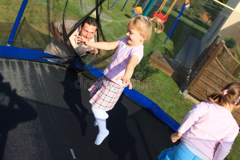 Family Playing in the Garden Stock Image - Image of daughter, jumping ...