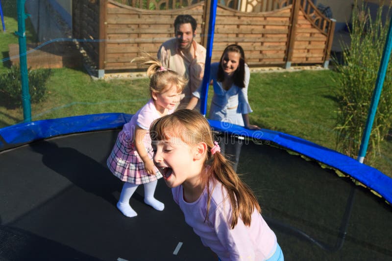 Family Playing in the Garden Stock Image - Image of group, people: 97195531