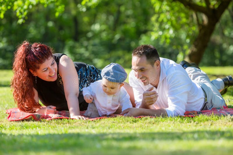 Family playing on grass stock photo. Image of lips, hold - 32337712