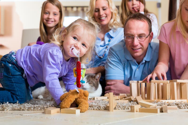 Family playing at home stock photo. Image of kids, couple - 26005752