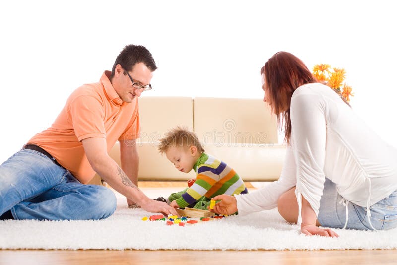 Family playing at home stock photo. Image of parenthood - 7628738