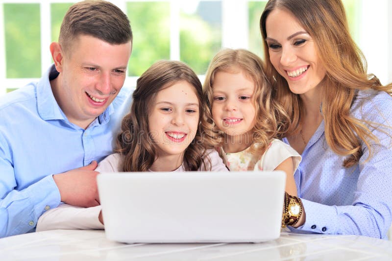 Family Playing on Laptop at Table Stock Image - Image of kids, health ...