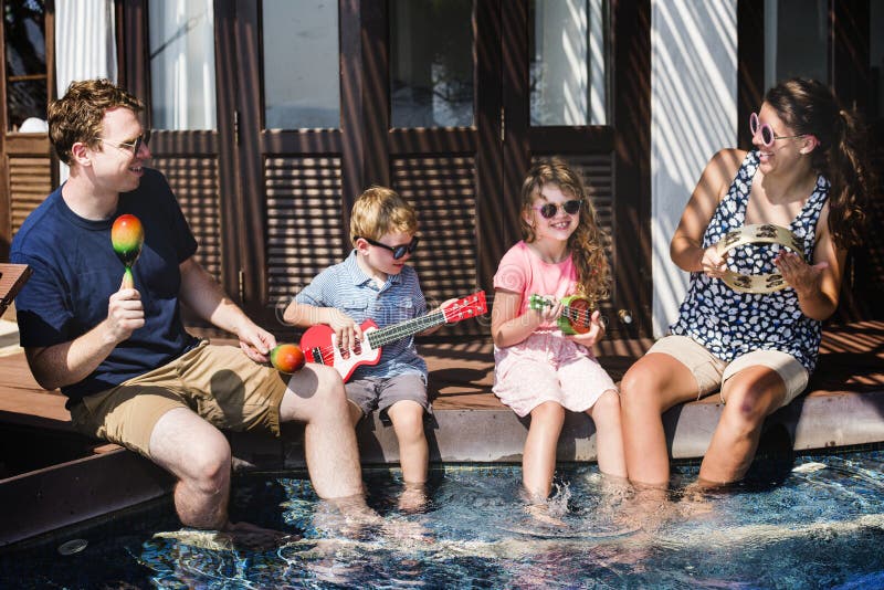 Family Playing Music by the Pool Stock Photo - Image of mother, happy ...
