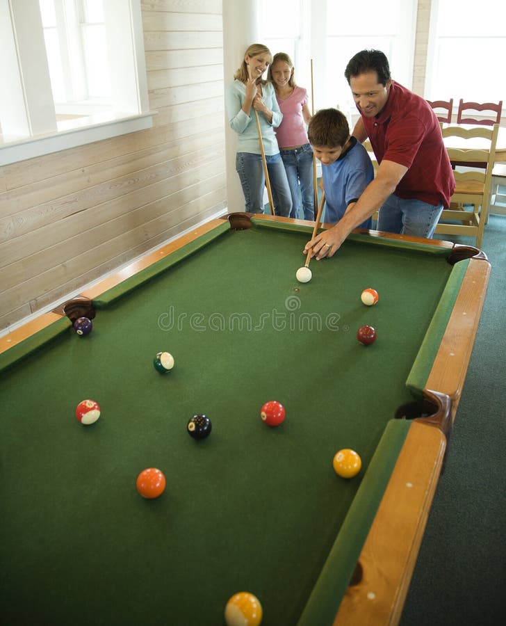 Family Playing Pool stock image. Image of inside, father - 12543447
