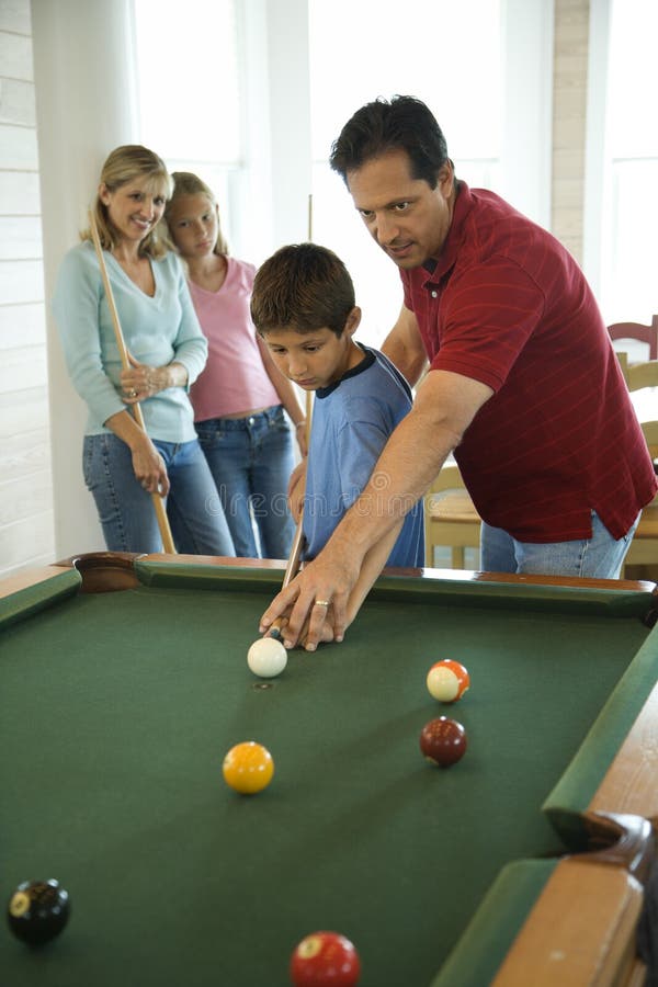 Family Playing Pool stock photo. Image of leisure, person - 12543504