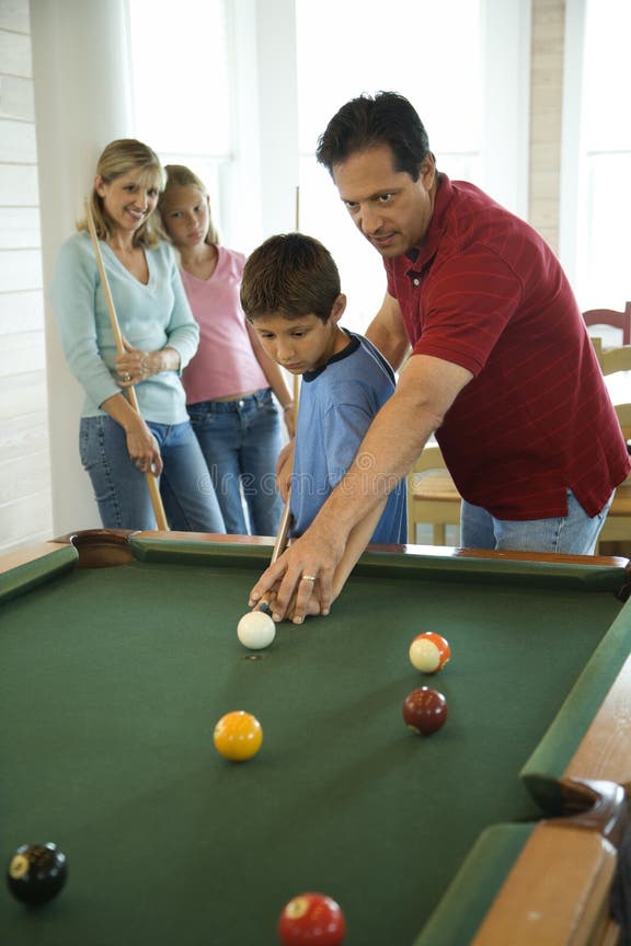 Family Playing Pool stock photo. Image of leisure, person - 12543504