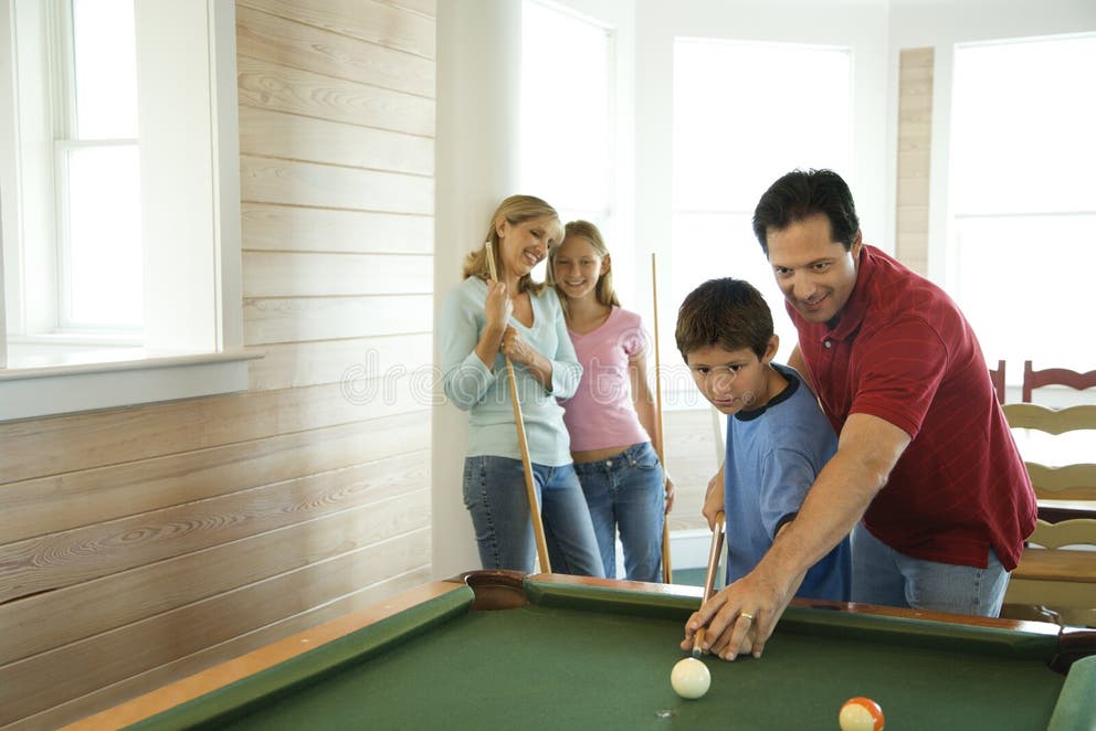 Family Playing Pool stock image. Image of four, adult - 12543617