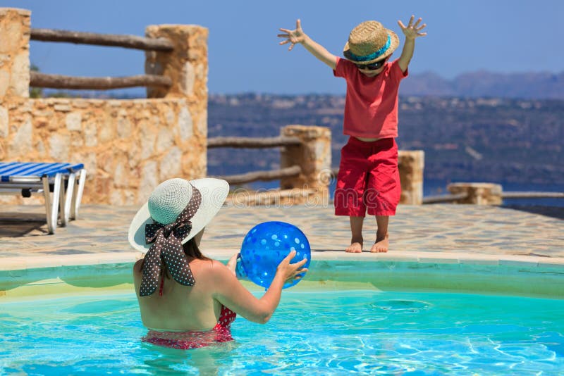 Family playing at the pool stock image. Image of outdoor - 32282619