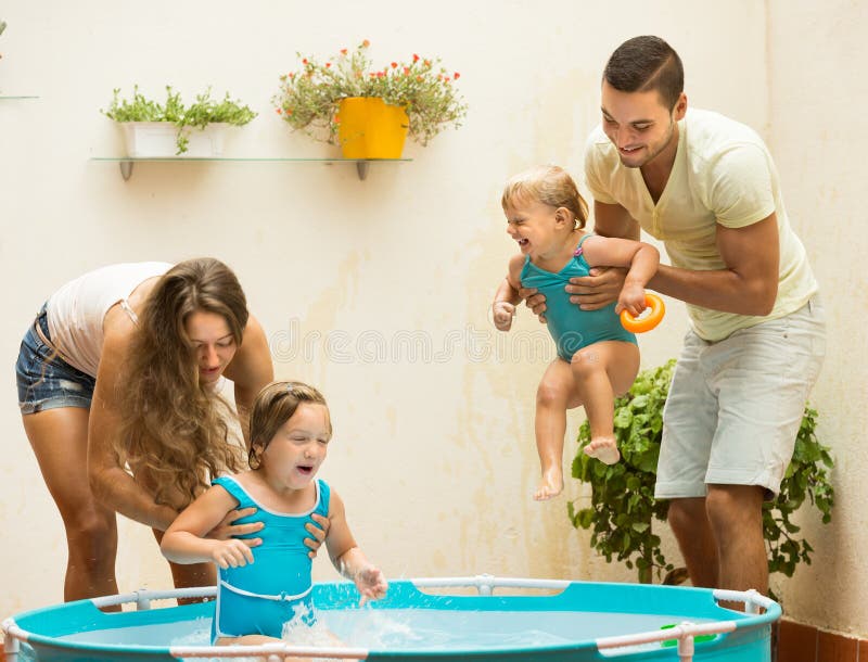 Family Playing in Pool at Terrace Stock Photo - Image of enjoying ...