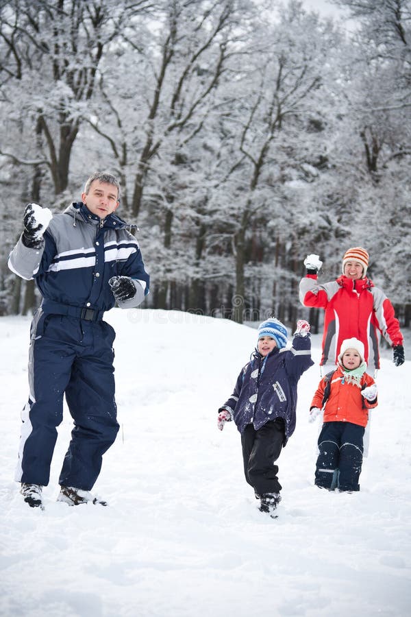 Family Pulling Sledge through Snow Stock Image - Image of people ...