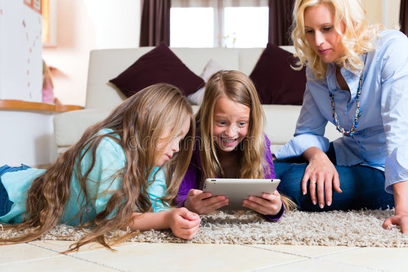 Family Playing with Tablet Computer at Home Stock Image - Image of chat ...
