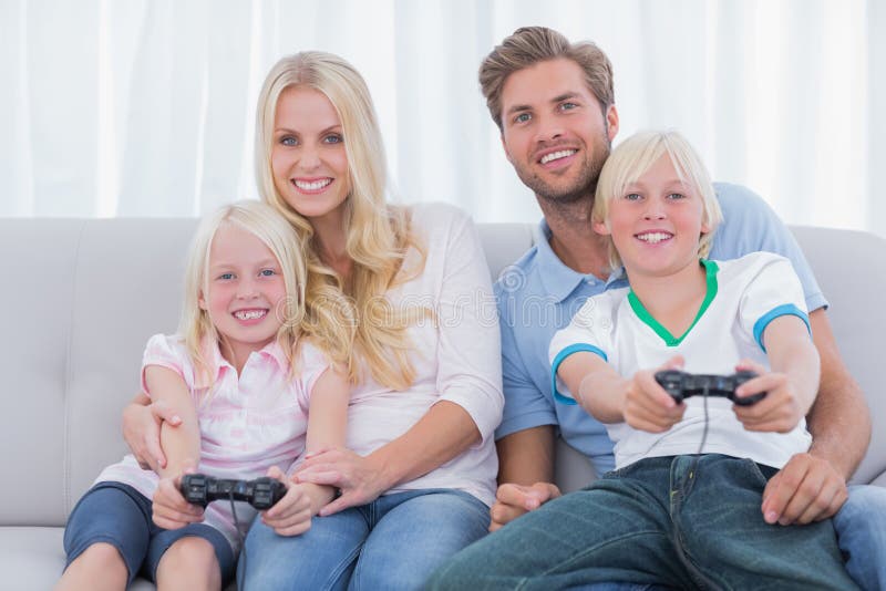 Family Playing Video Games at Home Stock Photo - Image of happy, homey ...