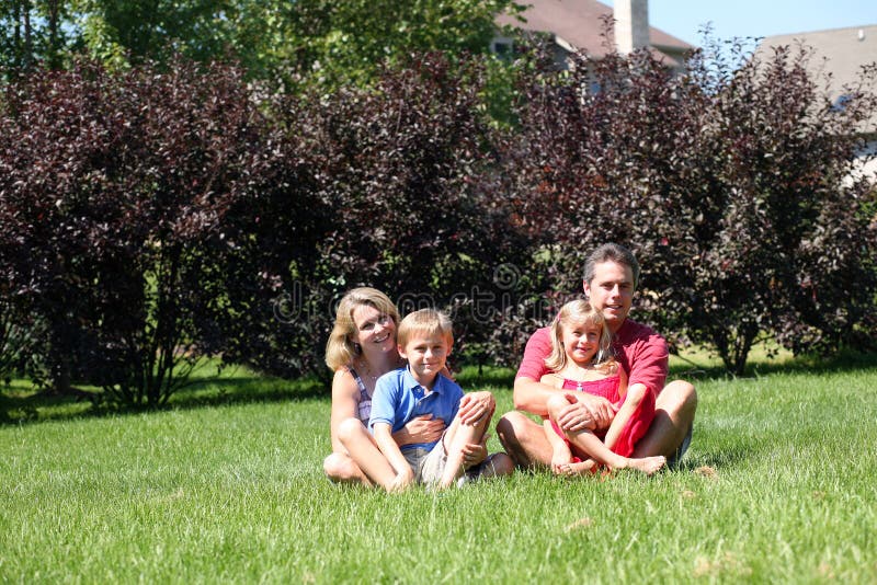 Happy family outside house stock photo. Image of colorful - 4027786