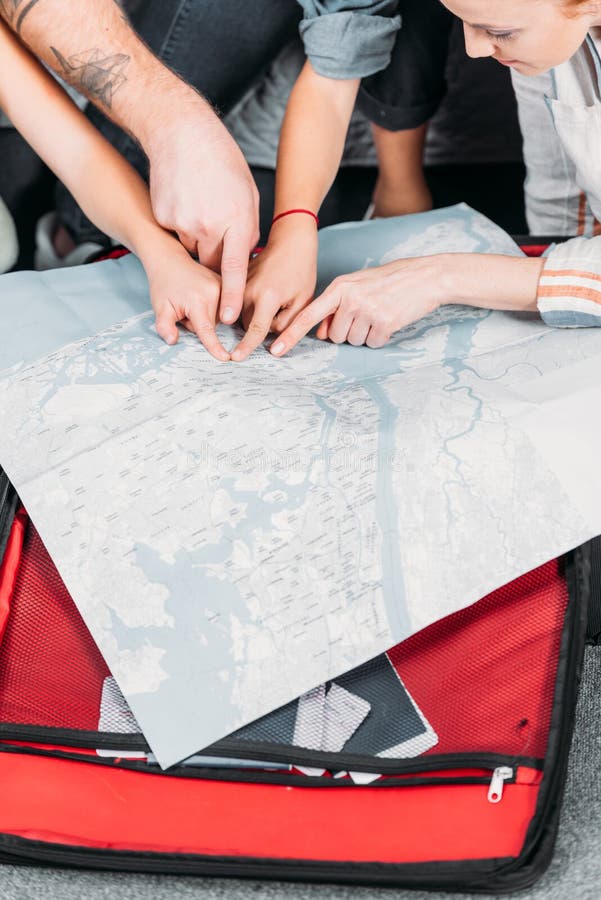 Cropped Shot of Family Pointing at Map while Stock Photo - Image of ...