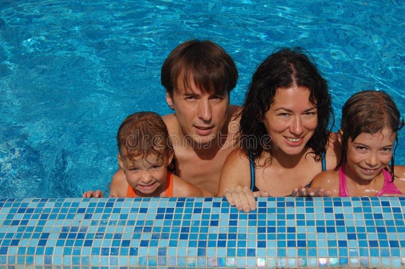 Family in the pool stock image. Image of enjoy, baby - 13021761