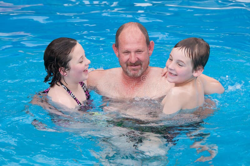 Family pool stock image. Image of play, smiling, swim - 21544173