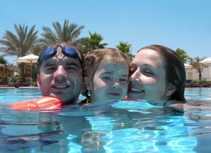 Family at the pool stock image. Image of cheerful, activities - 2622103