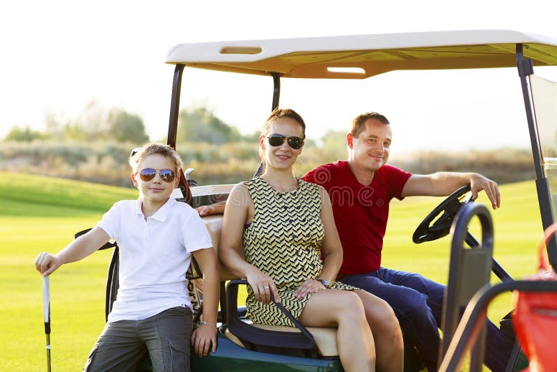 Family Portrait in a Cart at the Golf Course Stock Photo - Image of ...