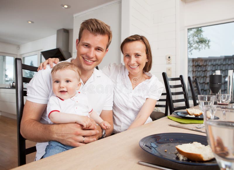 Family Portrait at Table stock image. Image of indoors - 20876587