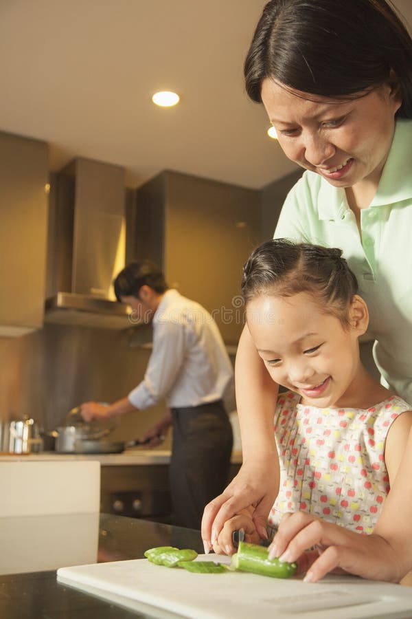 Family preparing dinner stock image. Image of child, cutting - 36762787