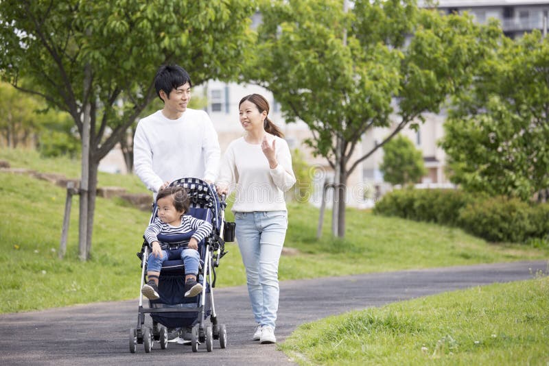 Family Pulled a Stroller To Walk in the Park Stock Photo - Image of ...