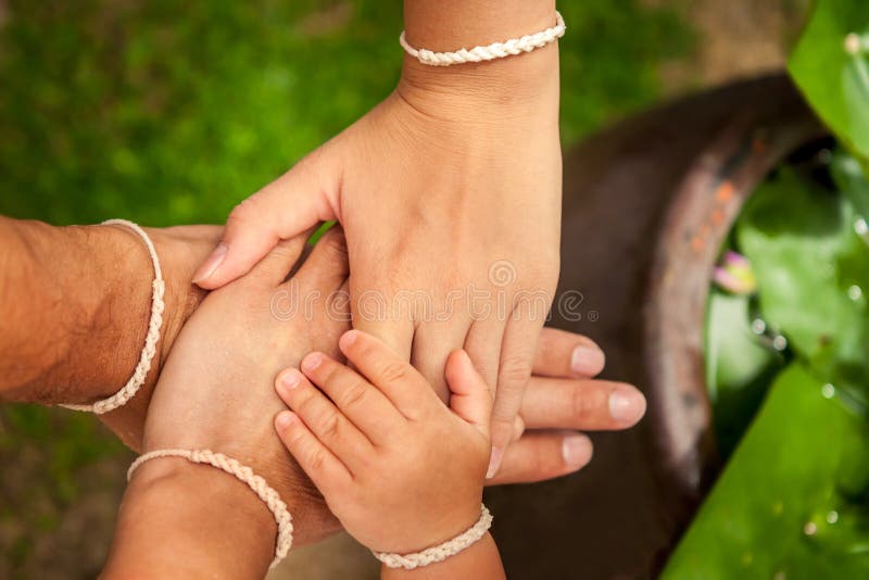 Family Putting Their Hands Together. Concept for Togetherness and Help ...